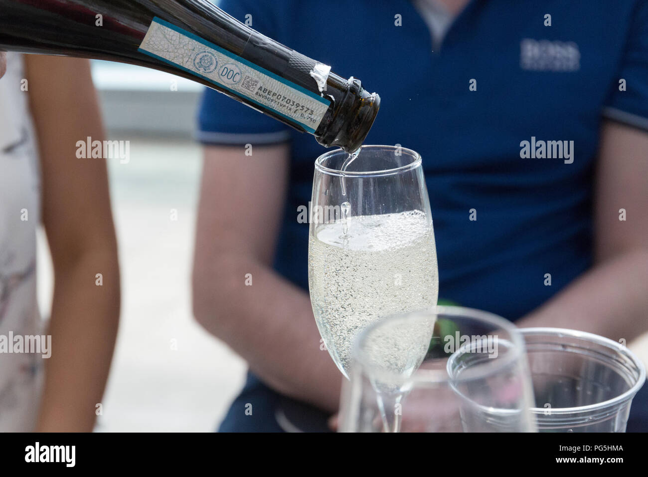 Pouring a glass of Prosecco Stock Photo - Alamy