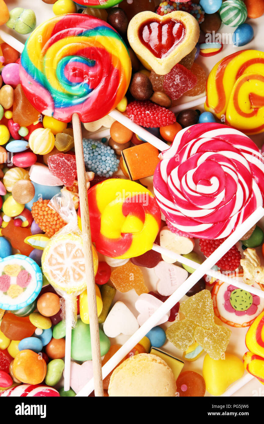 candies with jelly and sugar. colorful array of different childs sweets ...