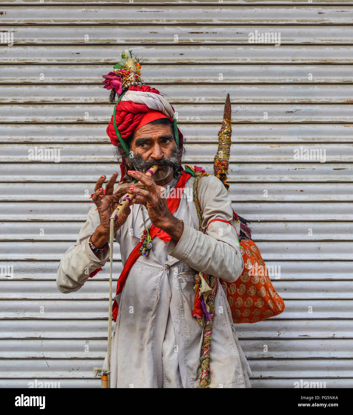Pushkar, India - Nov 5, 2017. Musician playing traditional Rajasthani ...