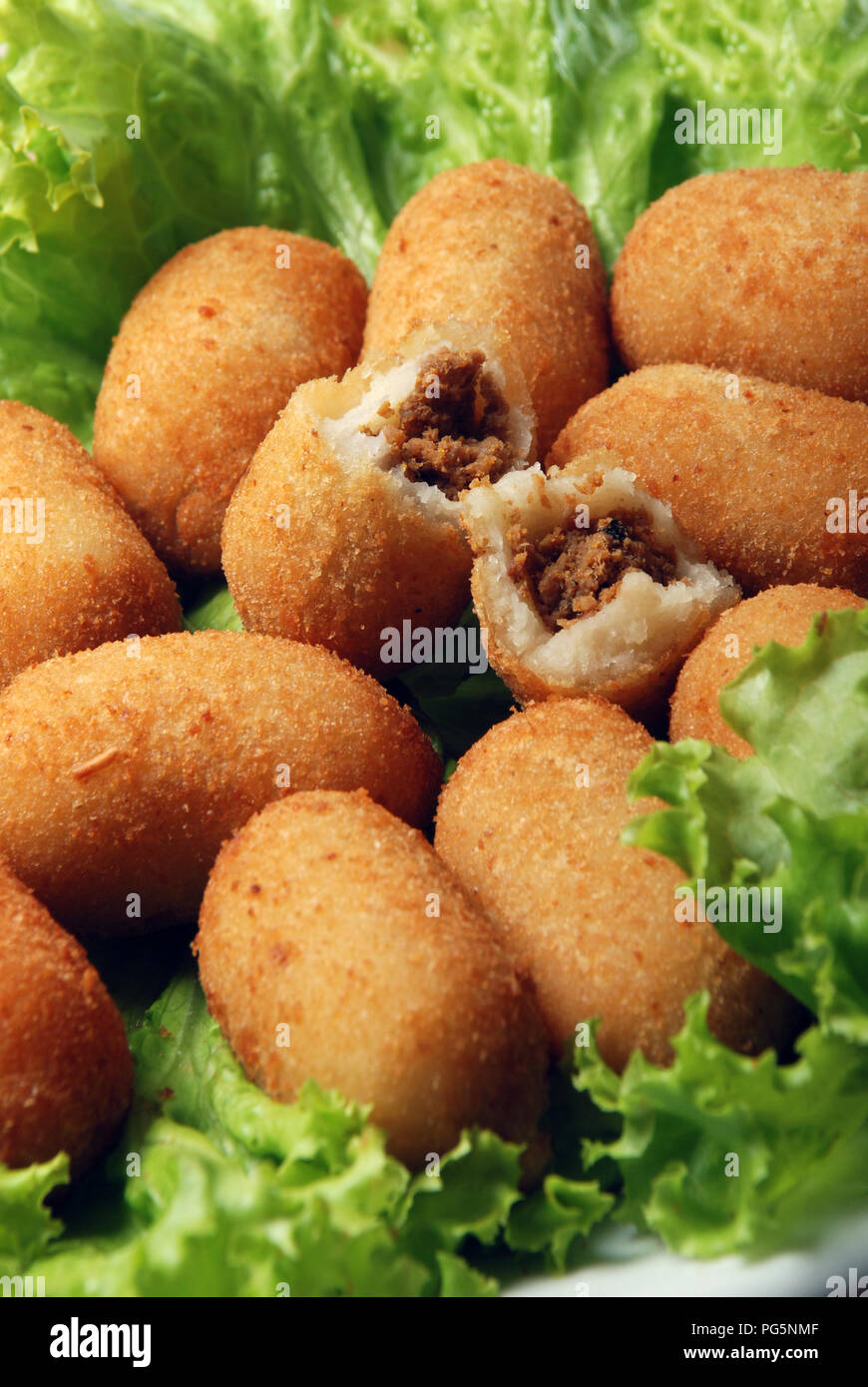 Delicious Brazilian snack, cassava and meat Stock Photo - Alamy