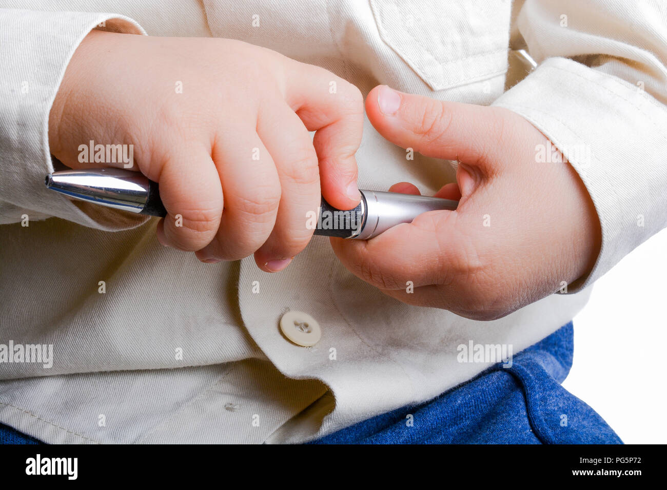 Baby holding a pen in his hand on a white background Stock Photo - Alamy