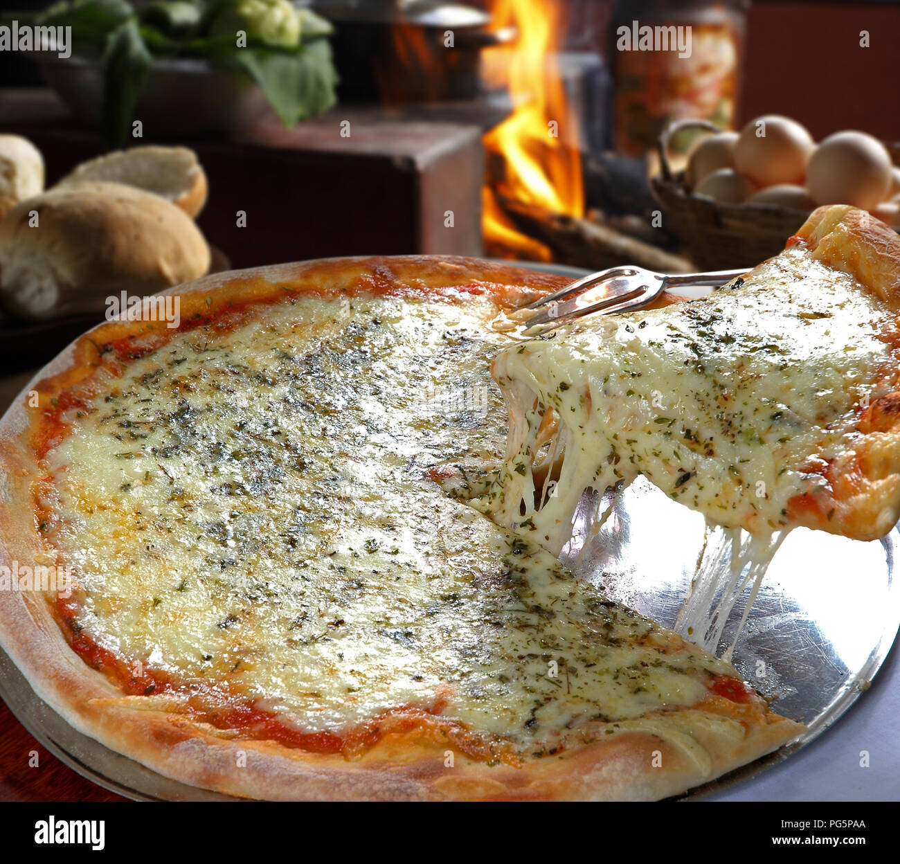 Pizza mozzarella with melted slice Stock Photo - Alamy