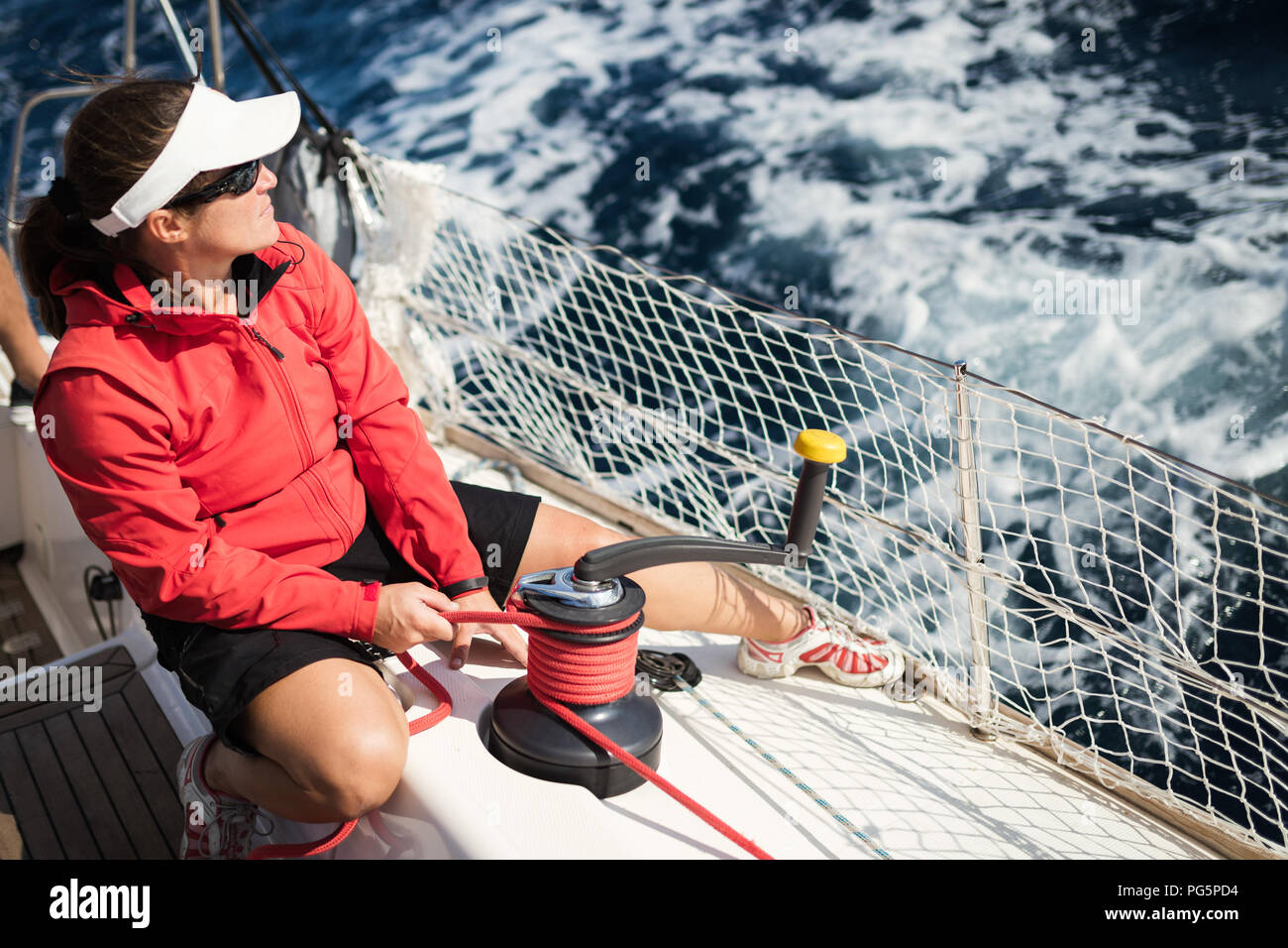 Attractive strong woman sailing with her boat Stock Photo - Alamy