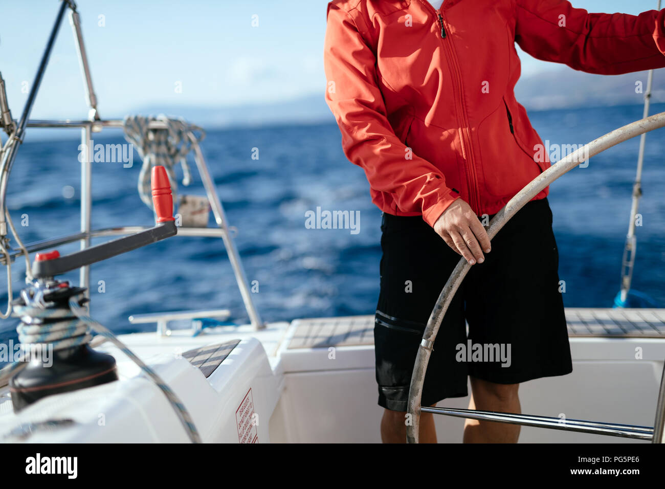 Attractive strong woman sailing with her boat Stock Photo - Alamy
