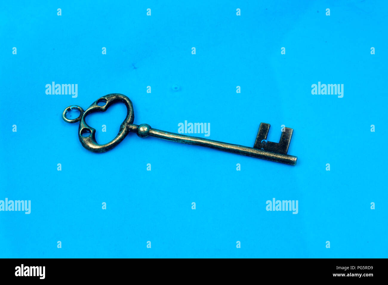 Retro styled key in water in blue background Stock Photo - Alamy