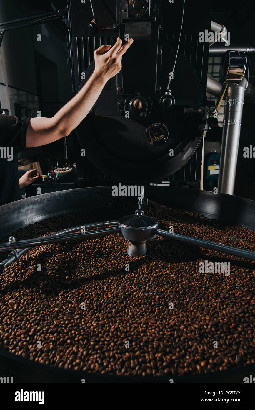 Male hands set up machine for professional coffee production Stock ...