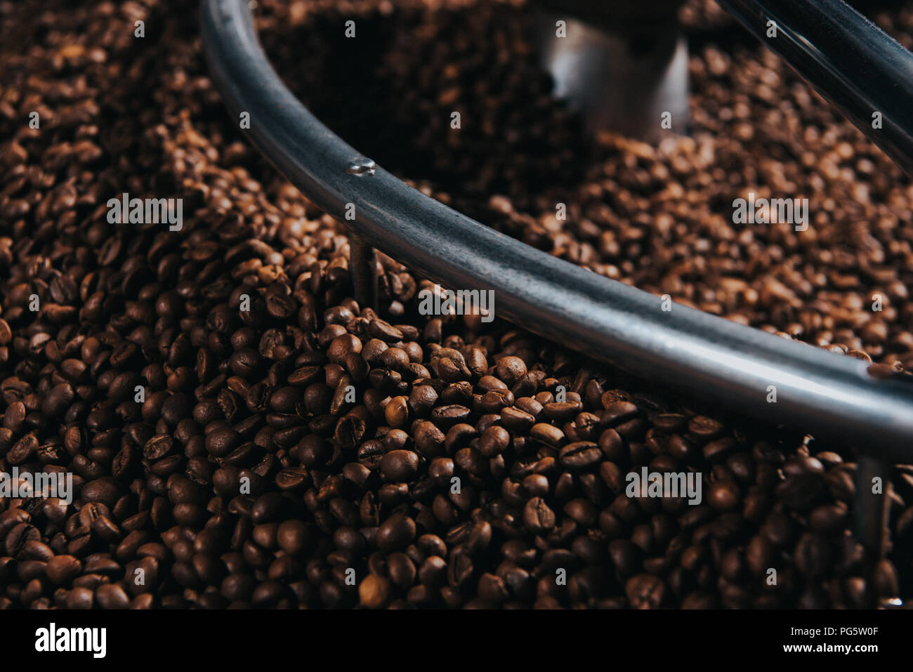Traditional coffee roaster with coffee beans in cylinder Stock Photo ...