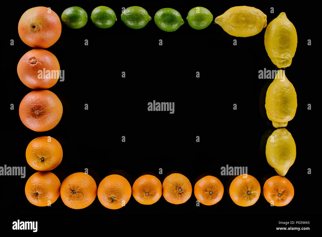 top view of frame made of ripe various citrus fruits isolated on black ...