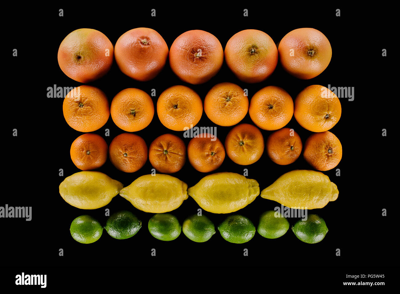 top view of composition of various ripe citrus fruits in rows isolated ...