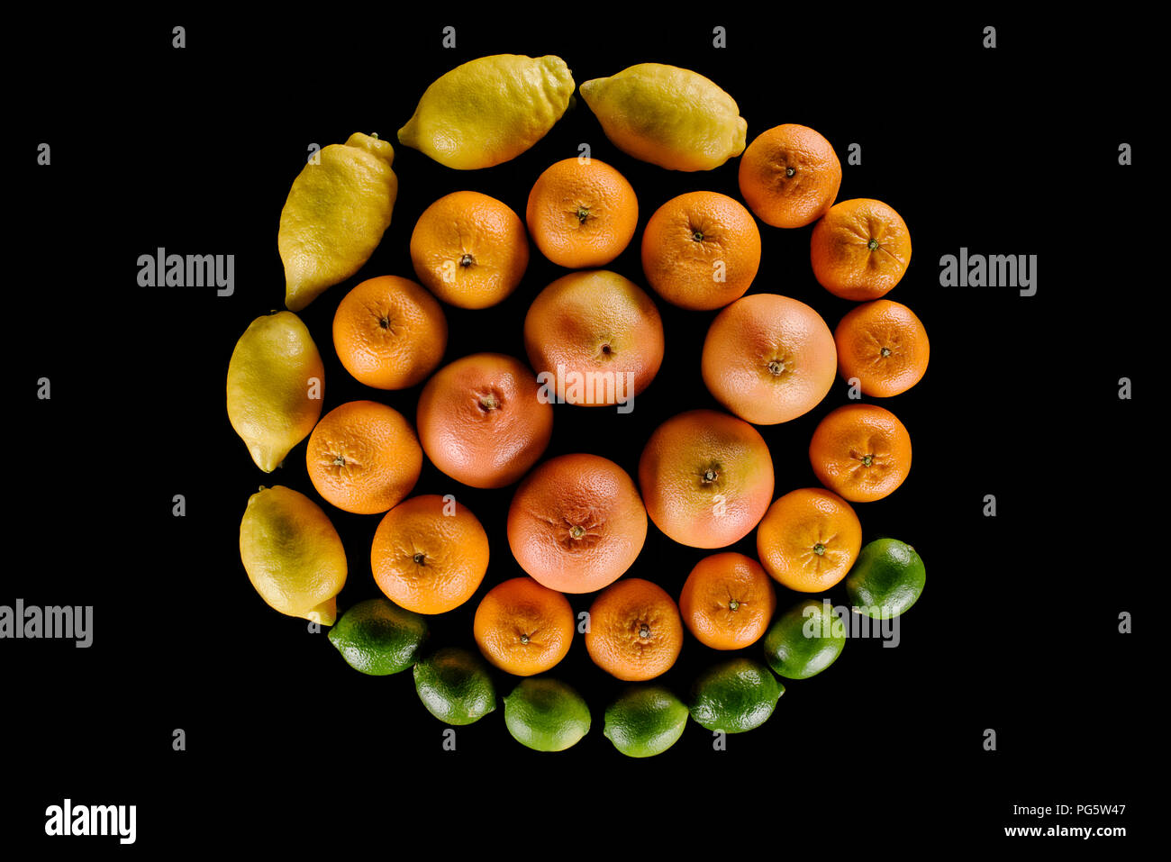 top view of various citrus fruits composition in spiral shape isolated ...