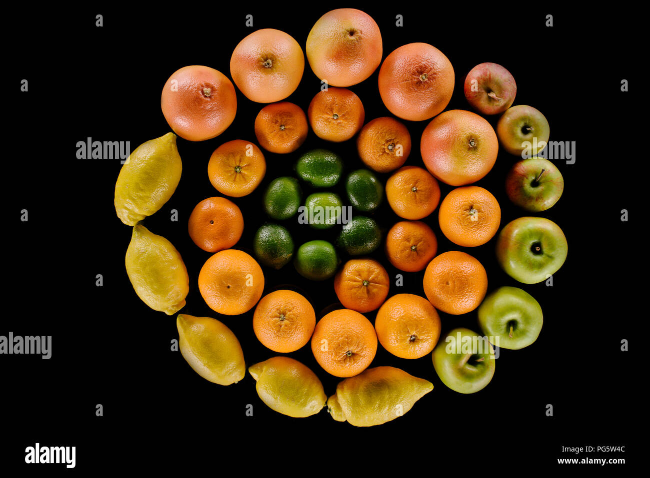 top view of various ripe citrus fruits composition in spiral shape ...