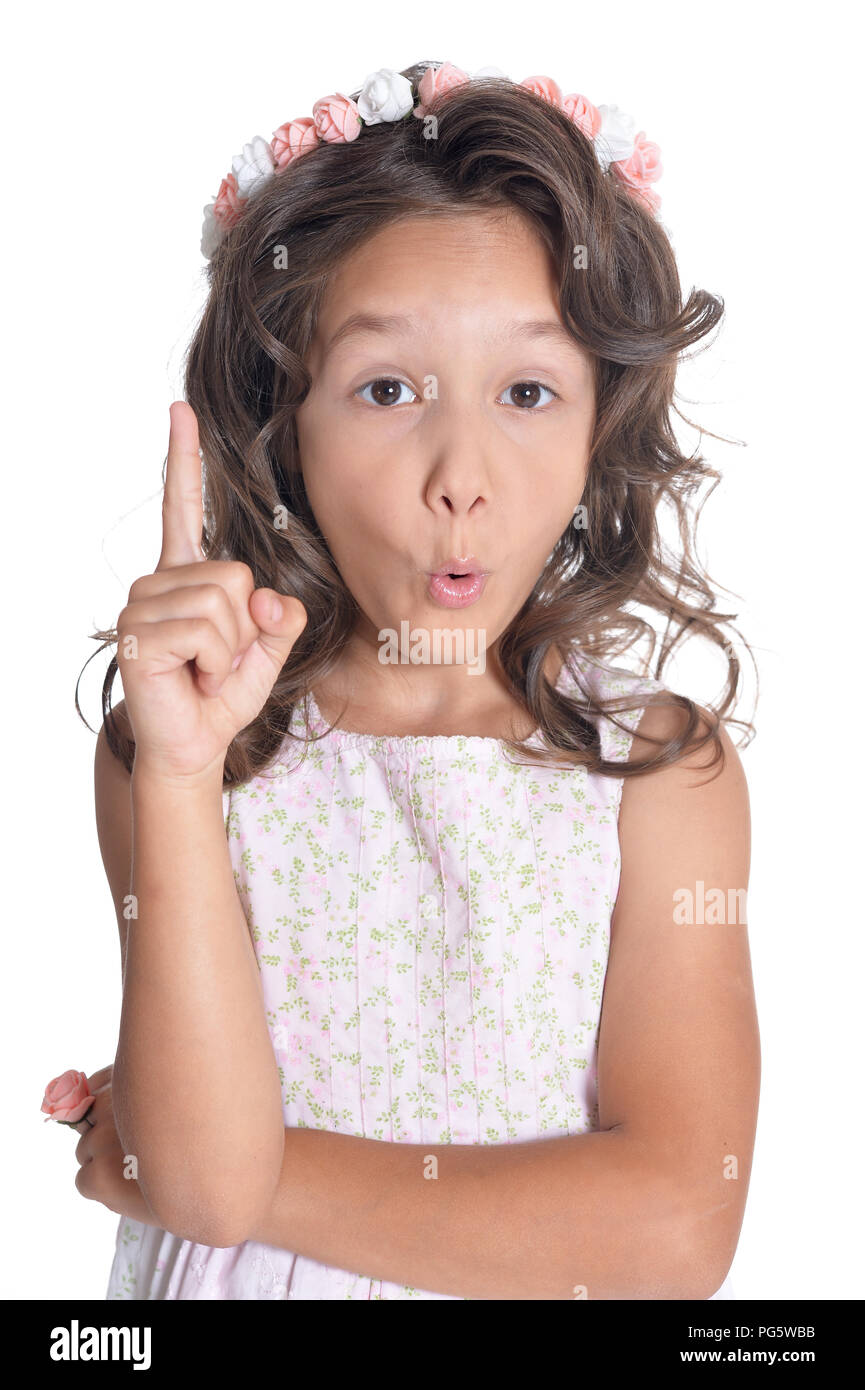 Happy little girl pointing up with finger isolated Stock Photo - Alamy