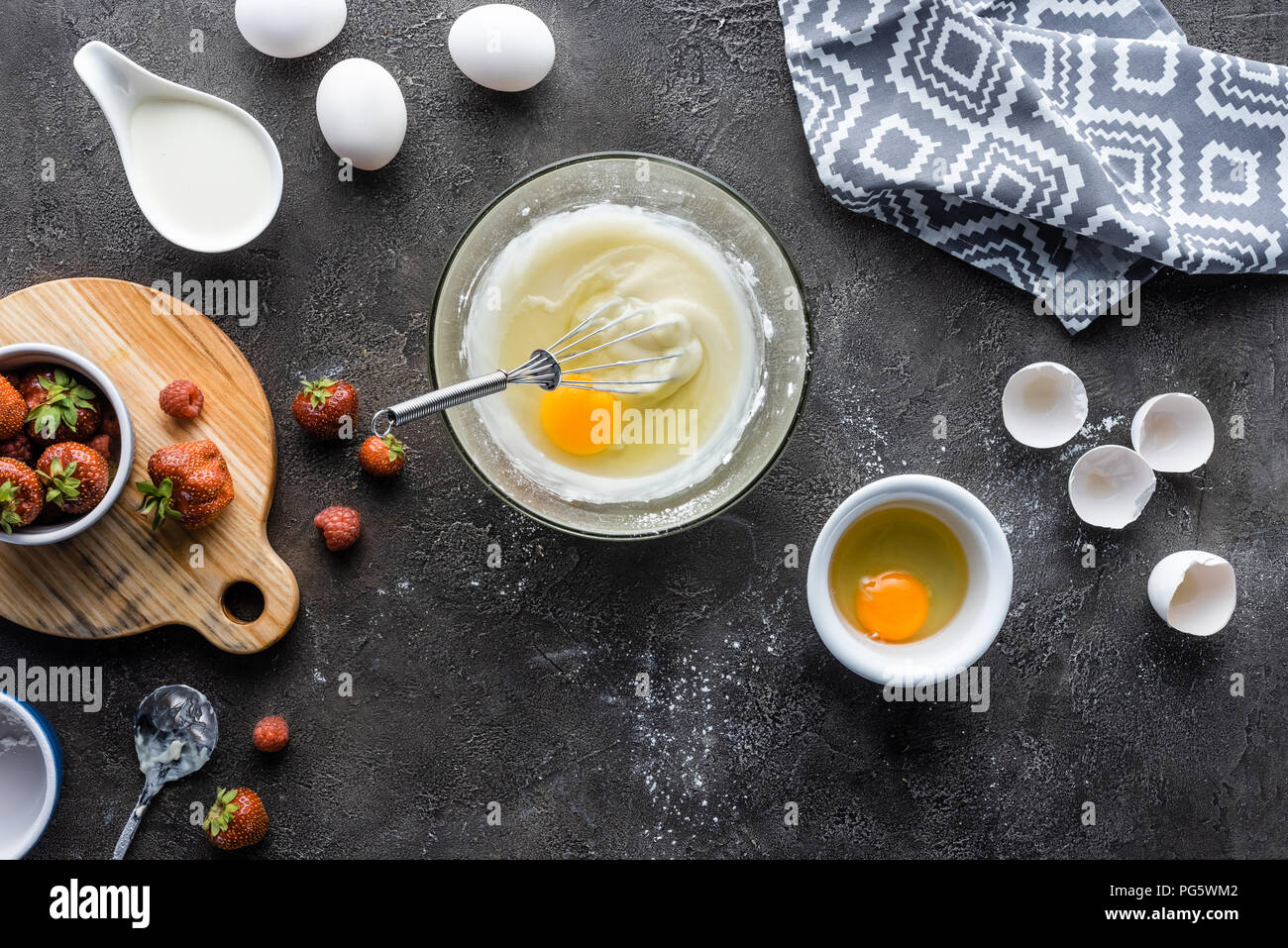 top view of making cream for pie process and arranged ingredients on ...