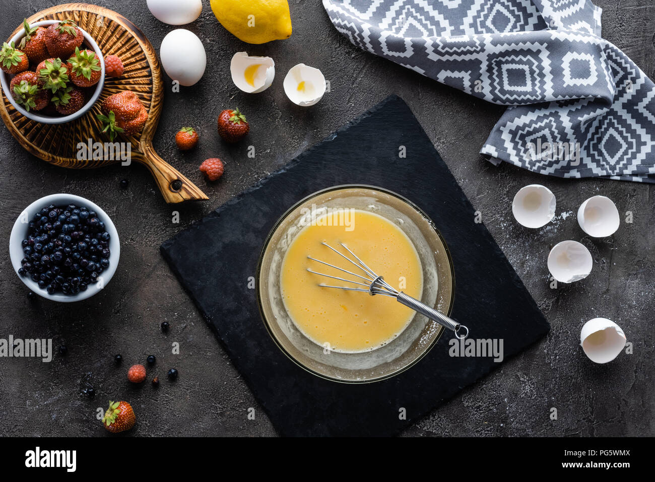 top view of making cream for pie process and arranged ingredients on ...