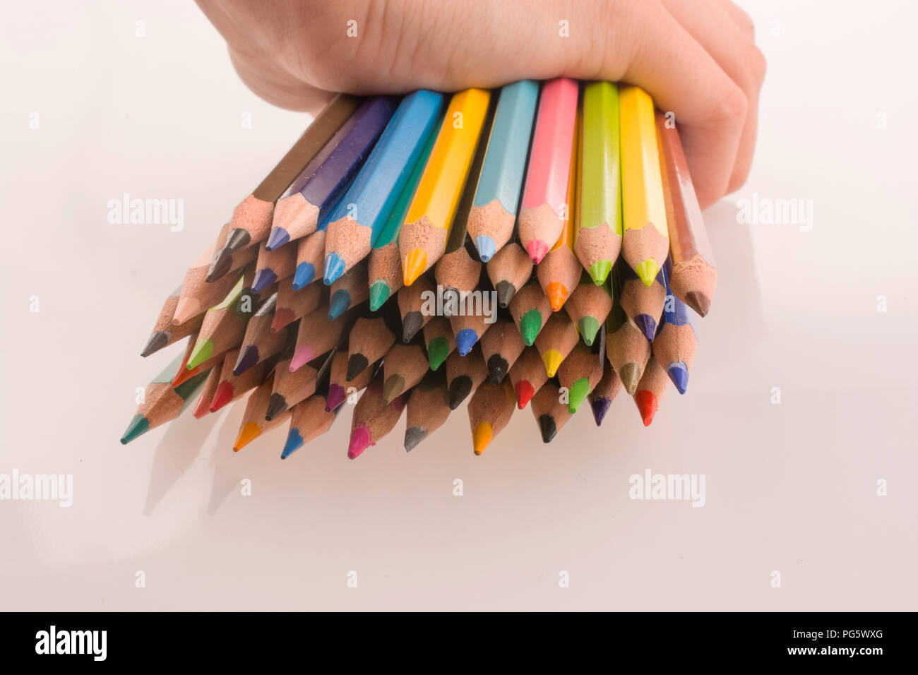 Hand holding Color pencils on a white background Stock Photo - Alamy