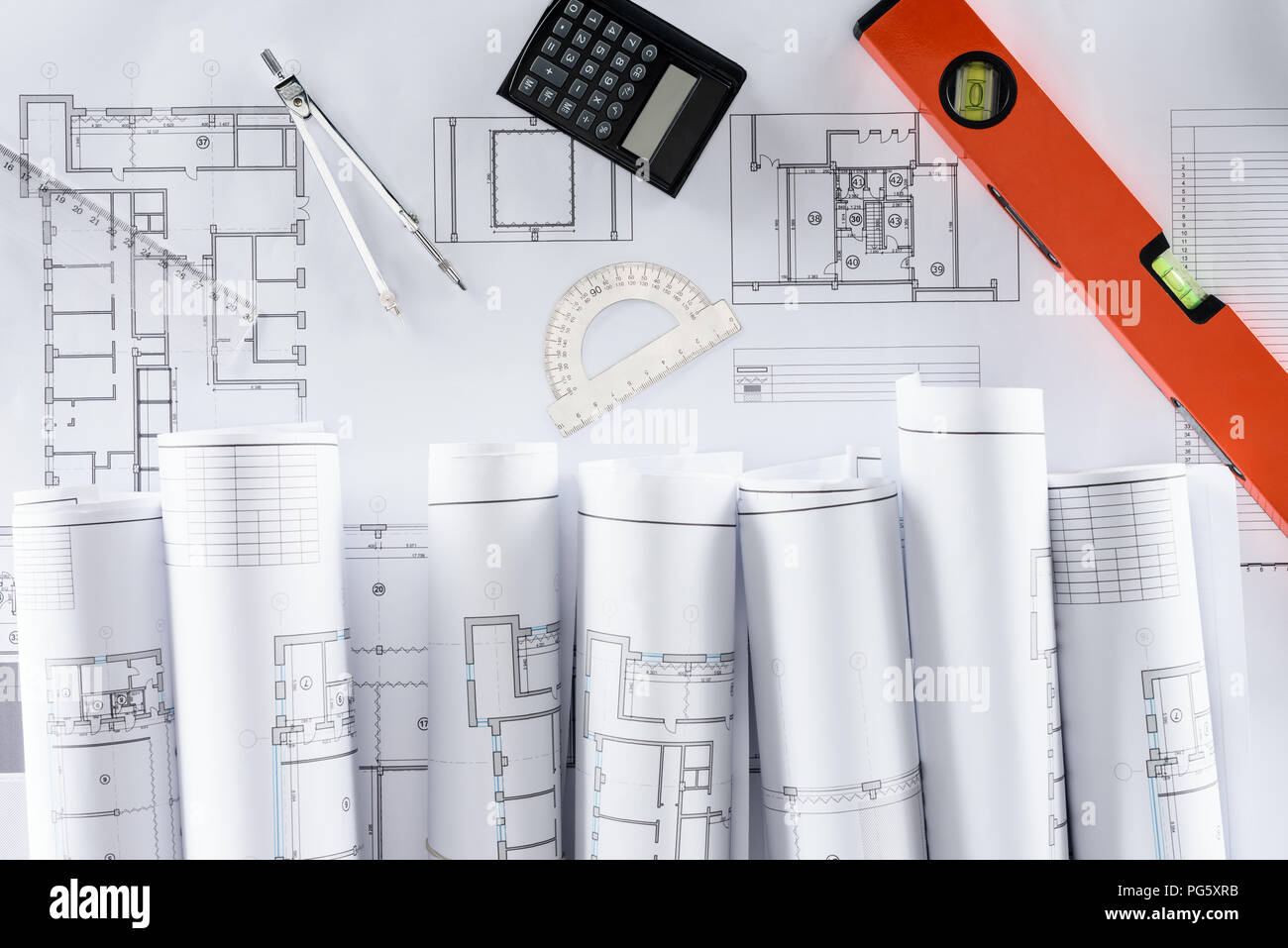 top view of architect blueprints, ruler, protractor, calculator ...