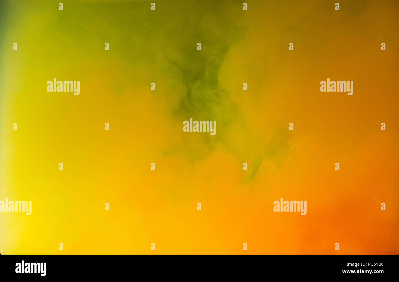 abstract bright yellow and orange ink explosion, artistic background ...