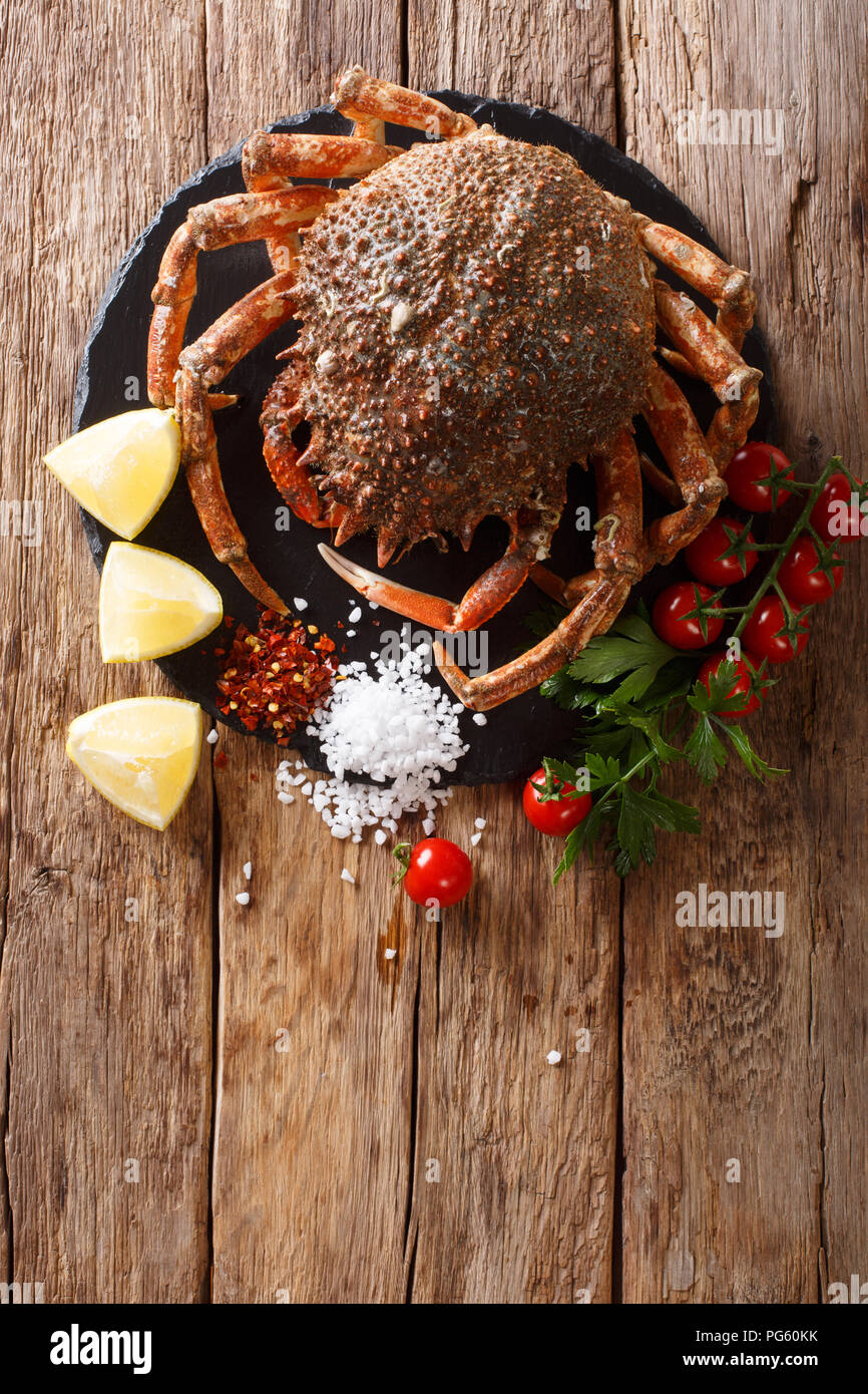 Seafood background: raw edible spider crab with ingredients close-up on ...