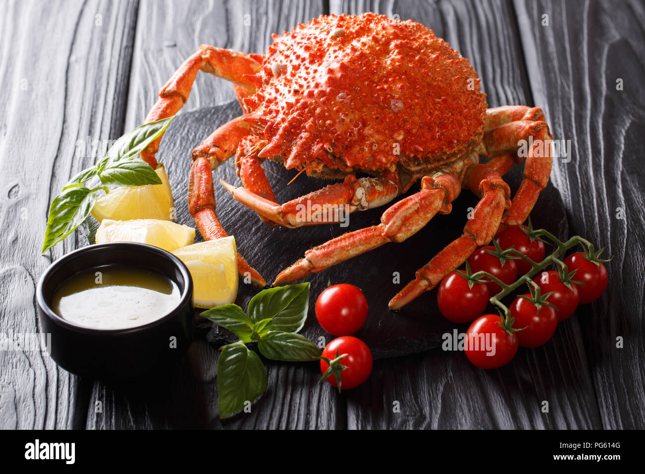 beautiful menu boiled spider crab is served with tomato, lemon and ...