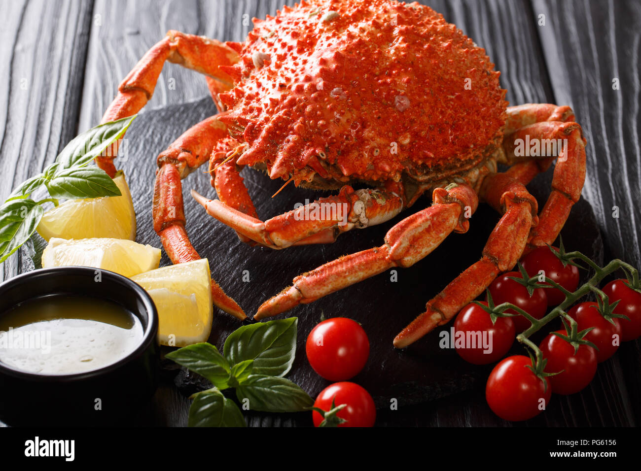 Gourmet boiled whole spider crab with lemon, tomatoes, bisillic and ...