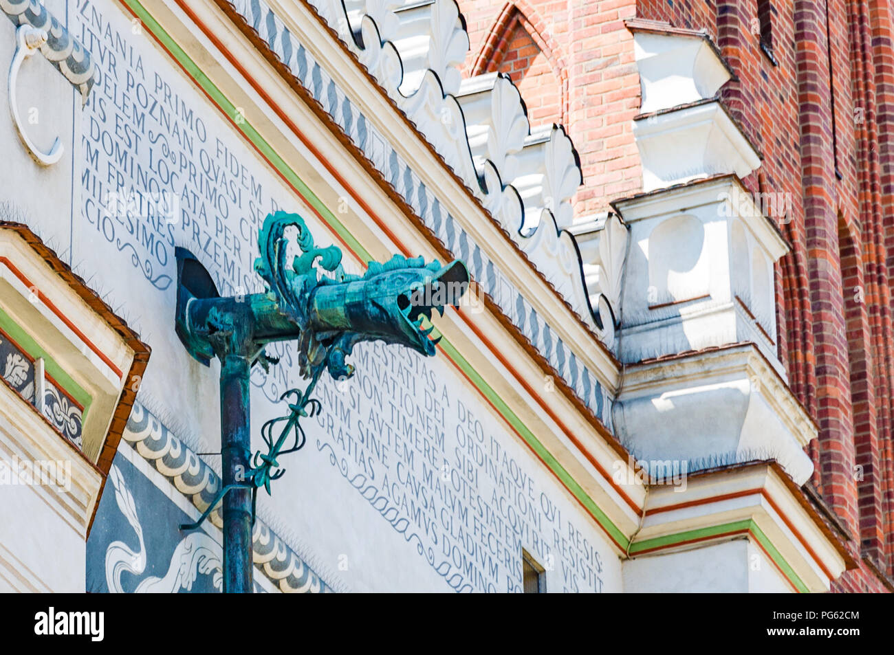 A copper green gargoyle and drain reach out from the ornate renaissance ...
