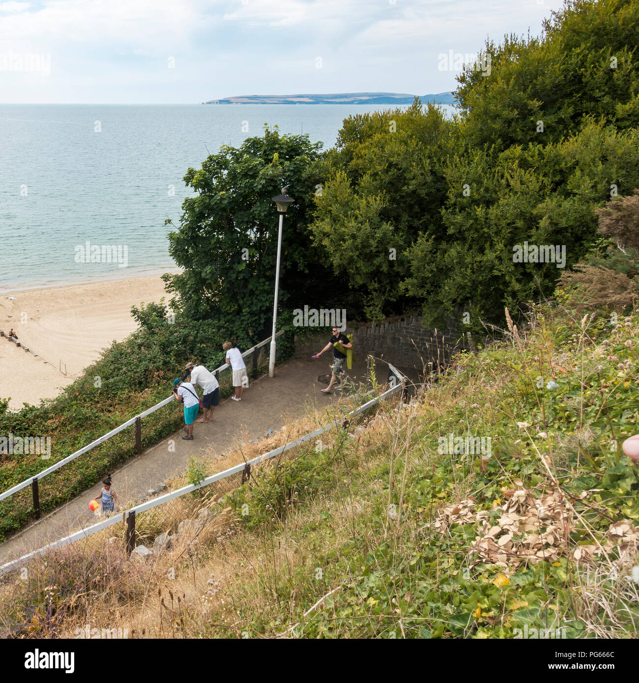 People taking photographs & looking over the cliffs on the West Cliff ...