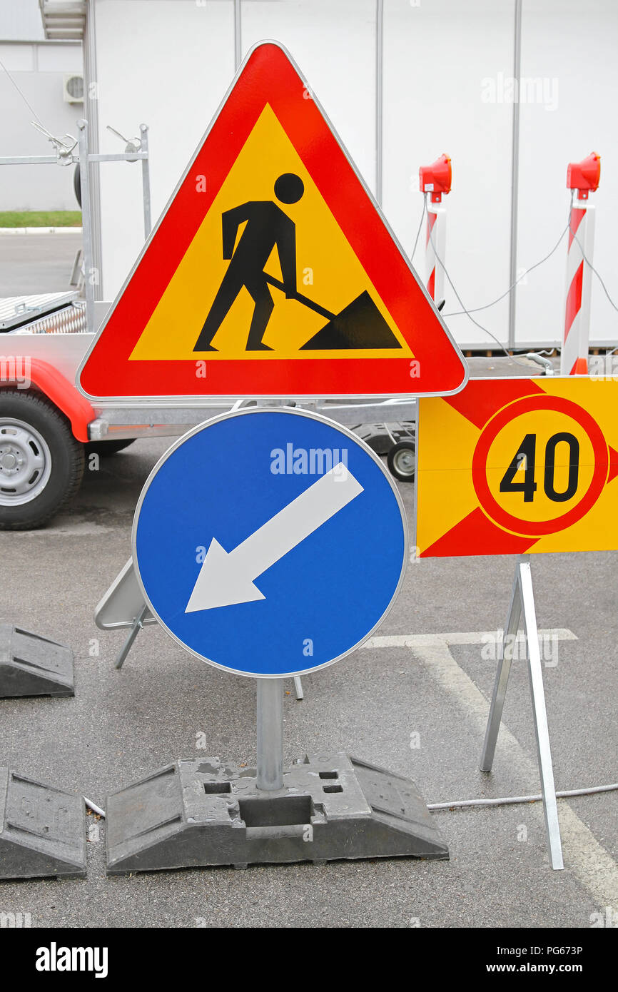 Road works traffic sign and direction arrow Stock Photo - Alamy