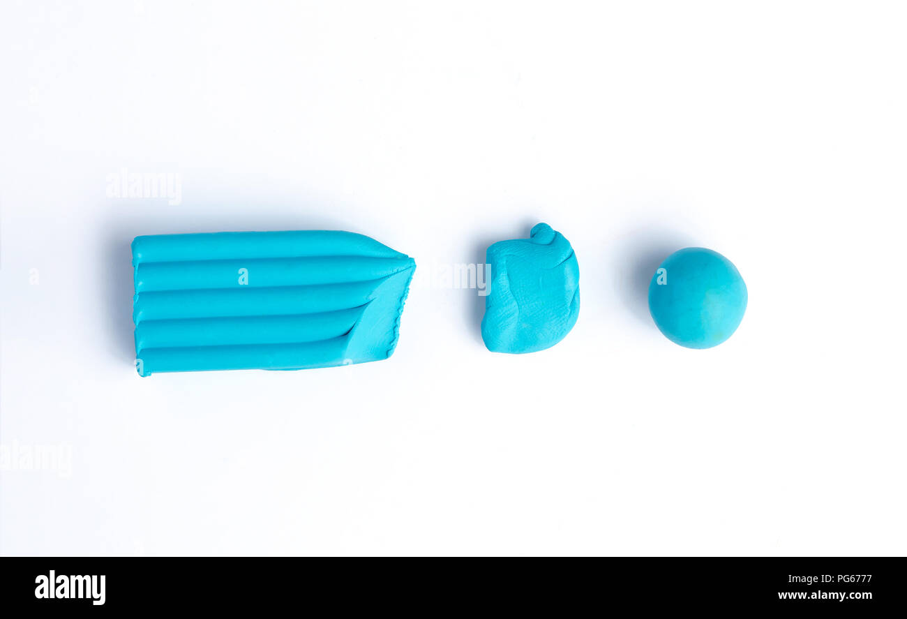 A piece of blue plasticine on a white background. Creatively for ...