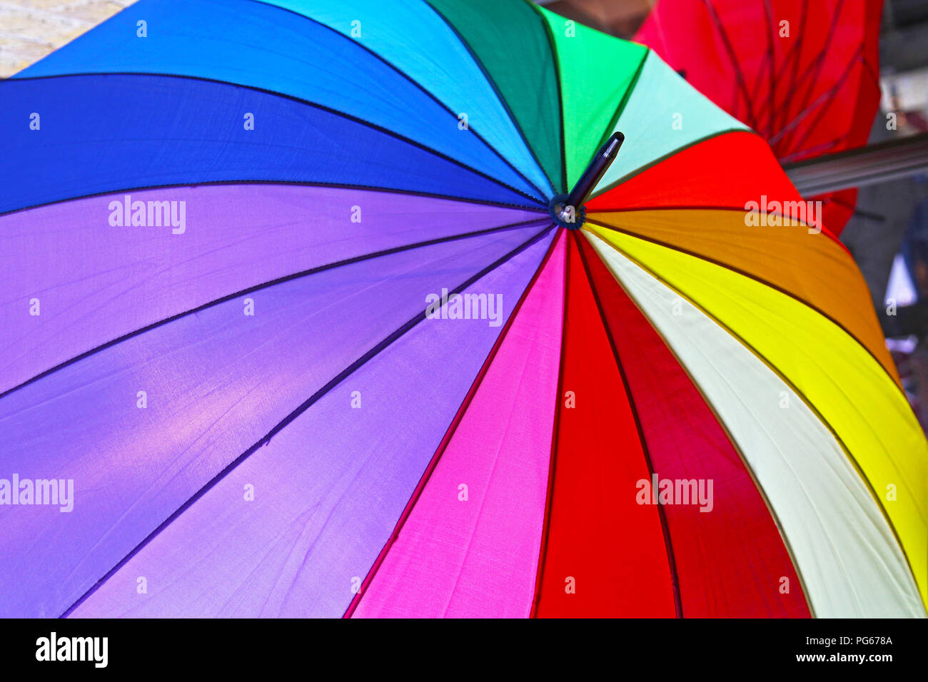All colors of rainbow at open parasol Stock Photo - Alamy