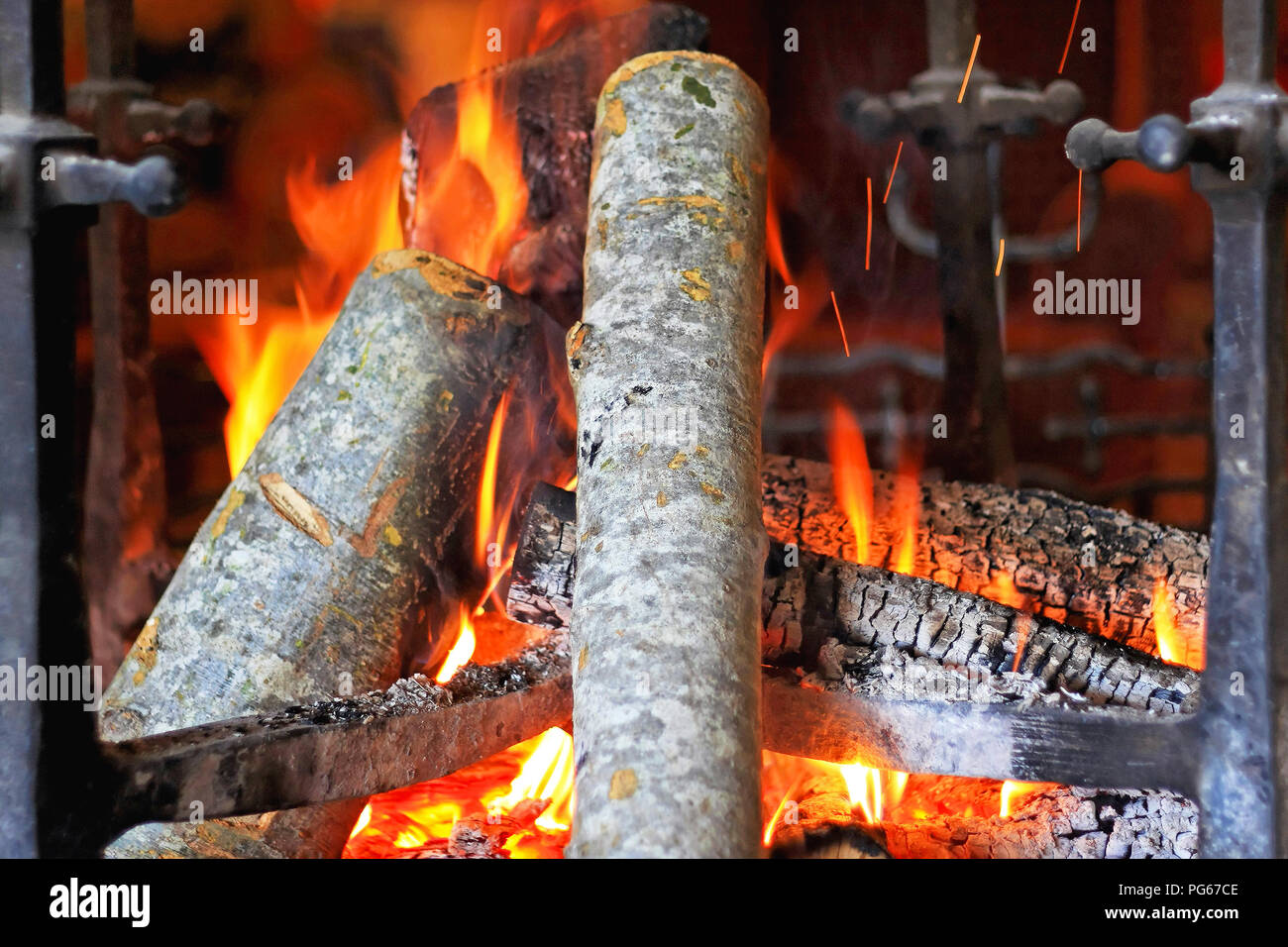 Ffireplace eith big log wood Stock Photo - Alamy