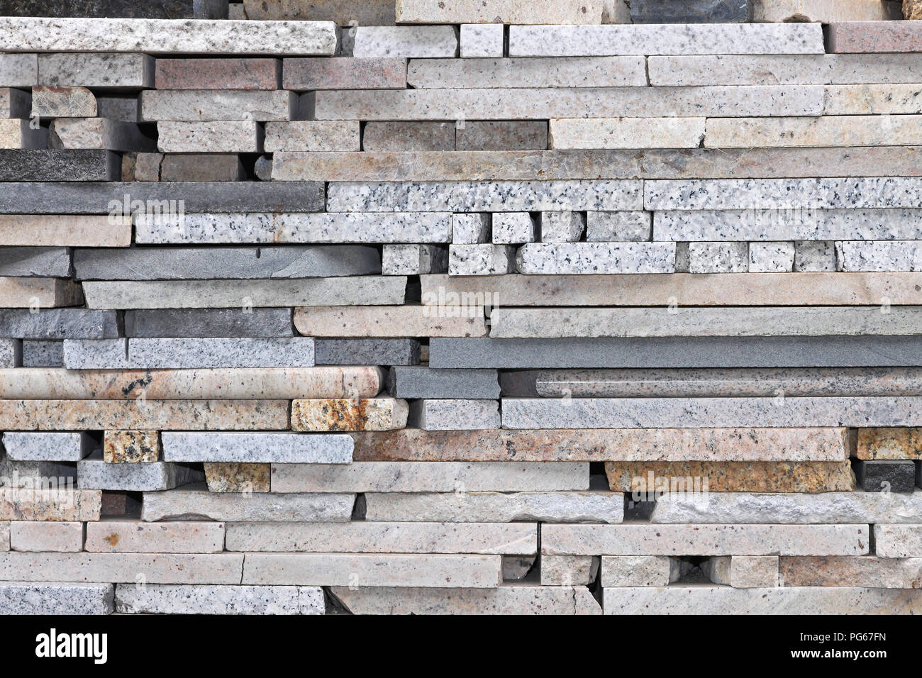 Big pile of various marble stone tiles Stock Photo - Alamy