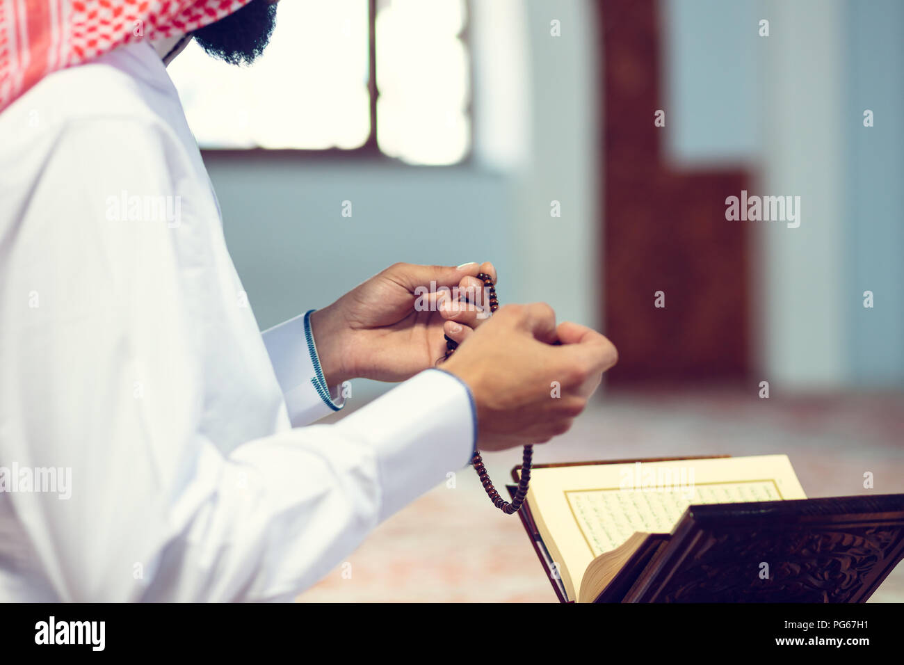 Religious muslim man praying inside the mosque Stock Photo - Alamy