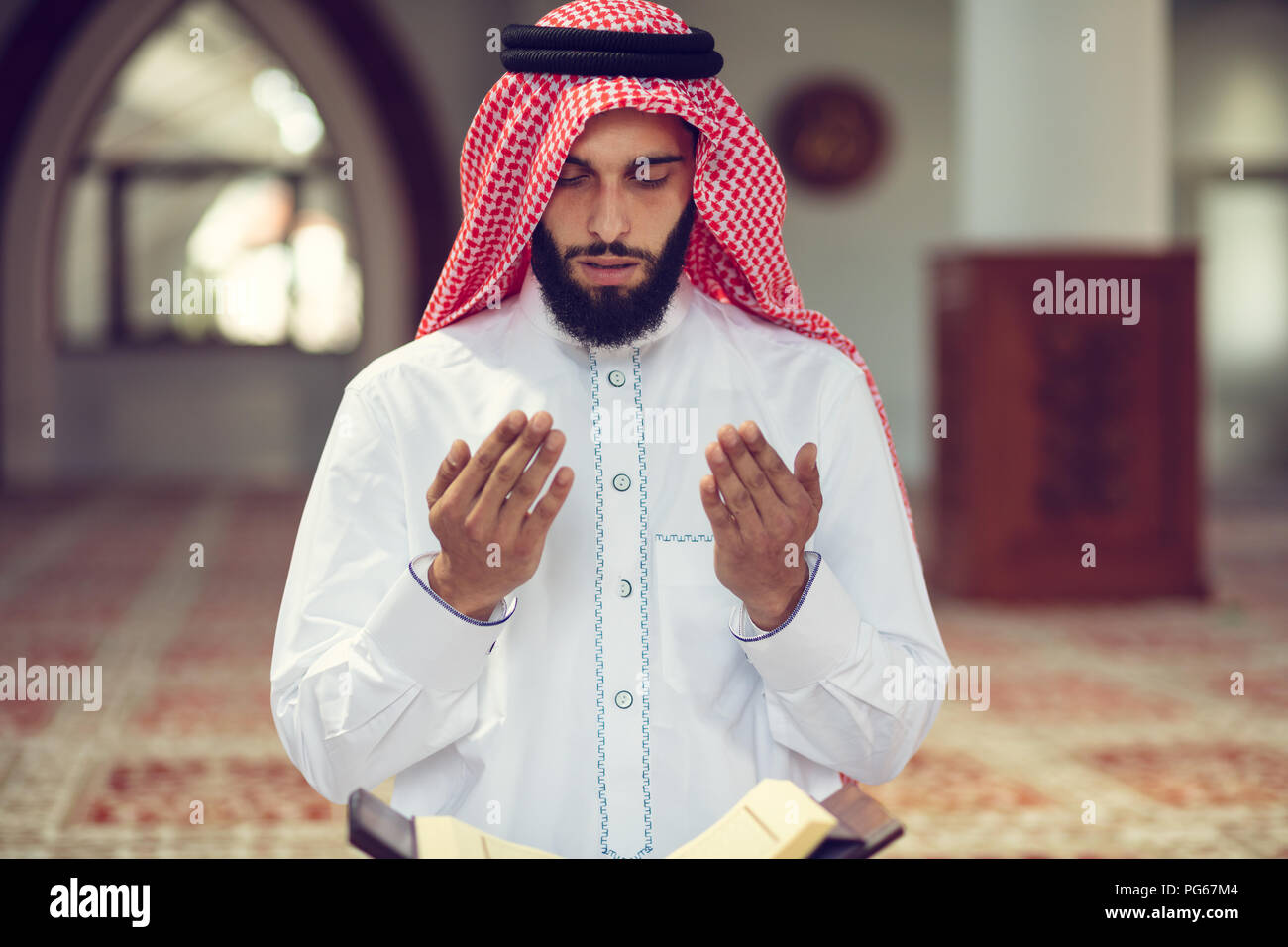 Religious muslim man praying inside the mosque Stock Photo - Alamy
