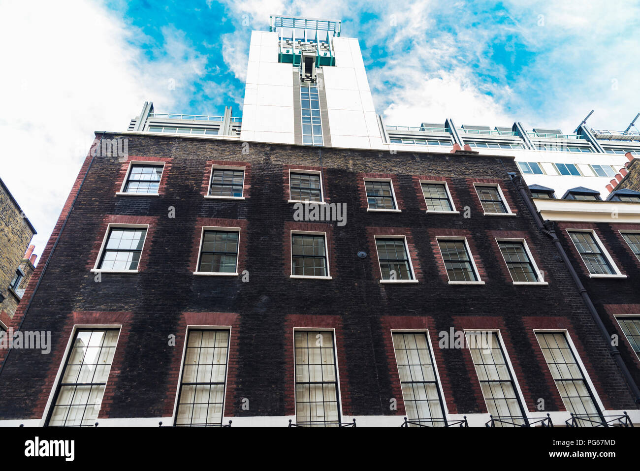 Facade of an old classic typical residential building in London ...