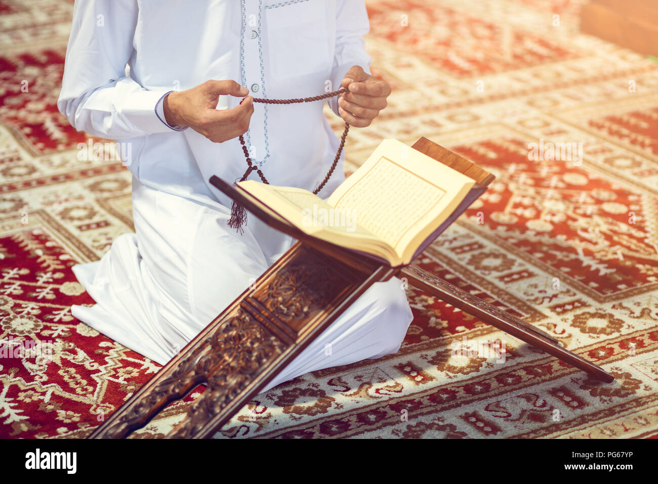 Religious muslim man praying inside the mosque Stock Photo - Alamy