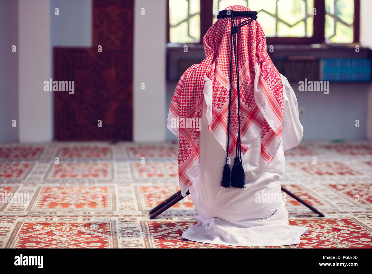 Religious muslim man praying inside the mosque Stock Photo - Alamy