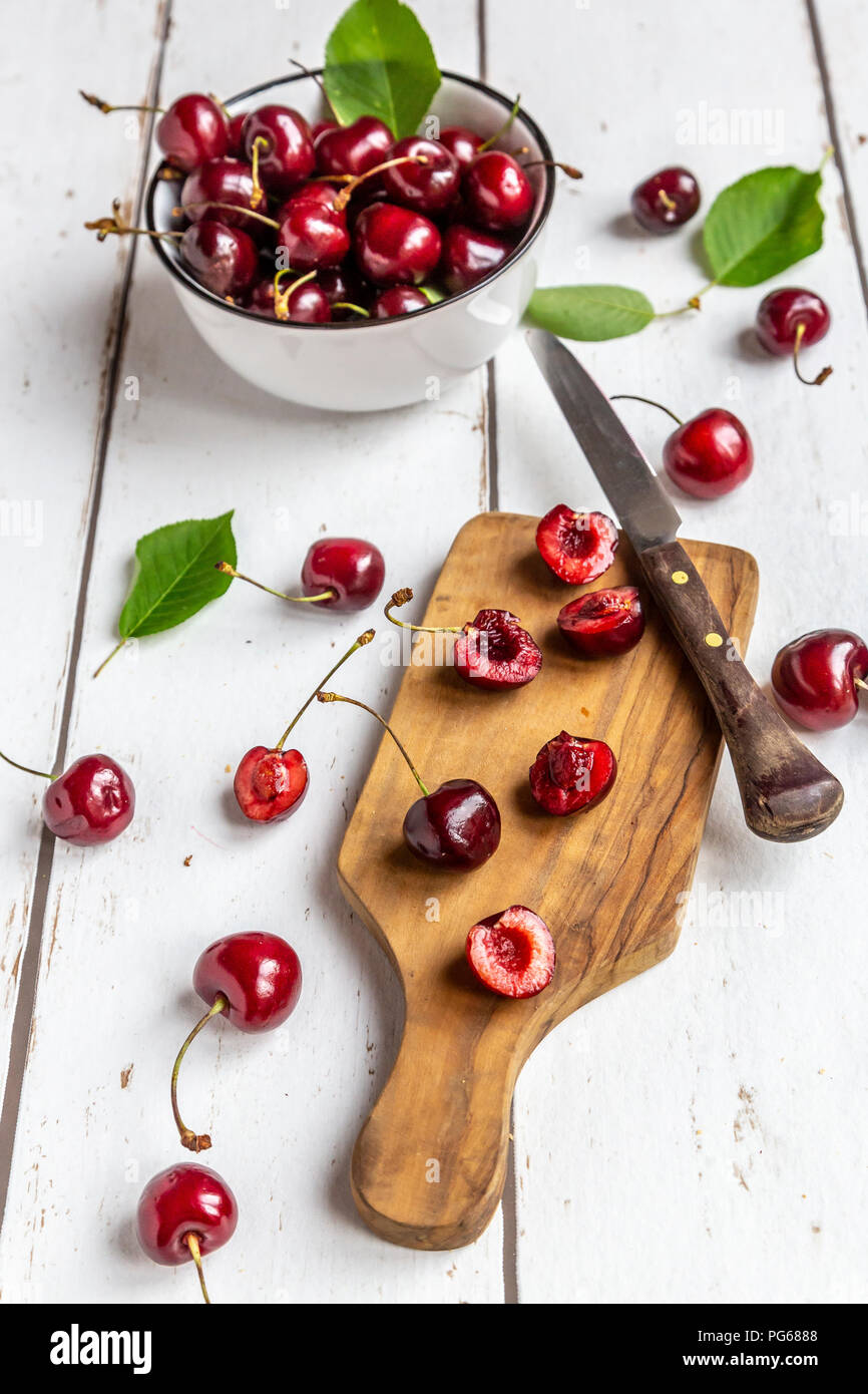 Sliced and whole cherries Stock Photo - Alamy