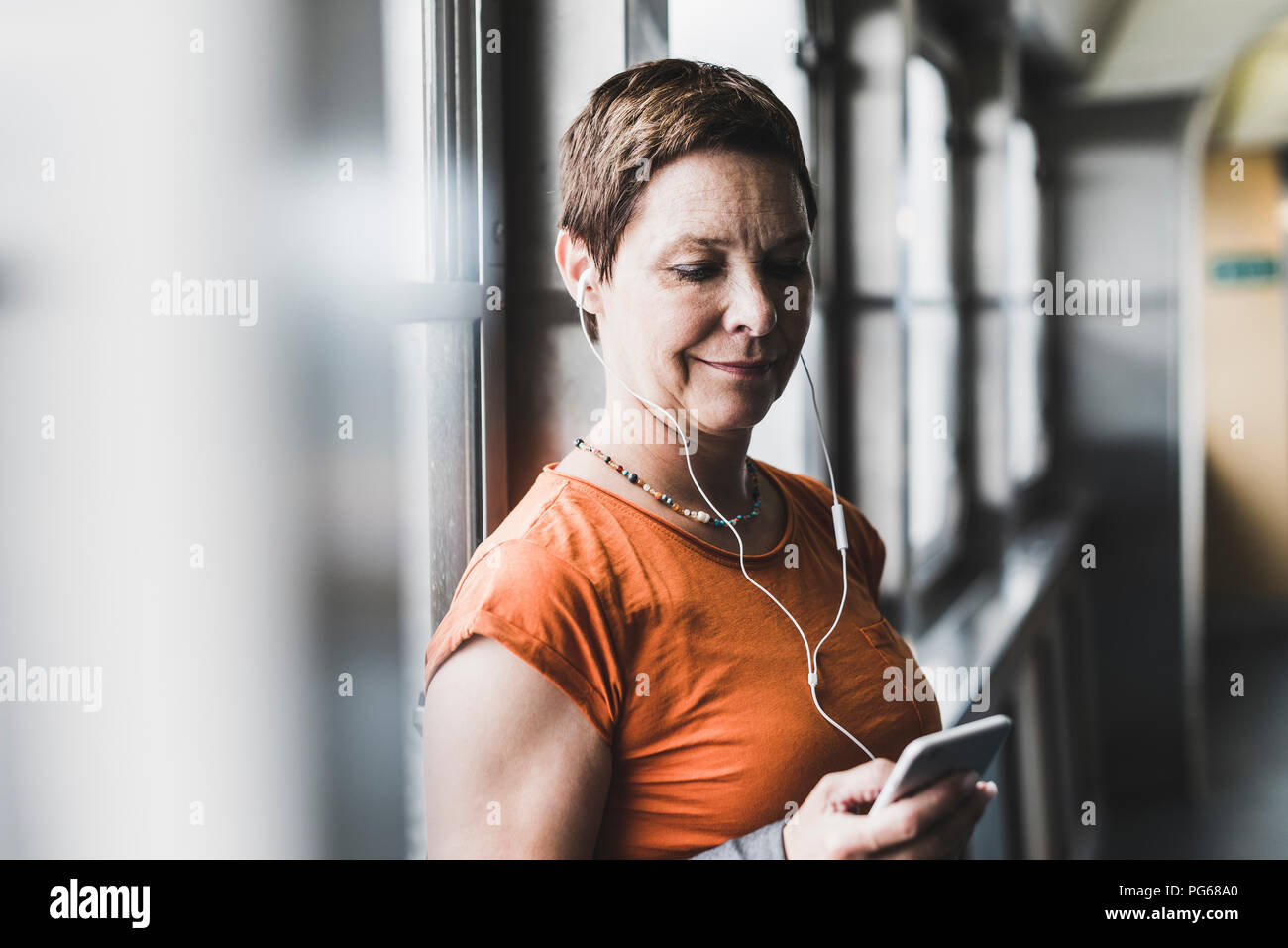 Woman on ferry deck smiling hi-res stock photography and images - Alamy