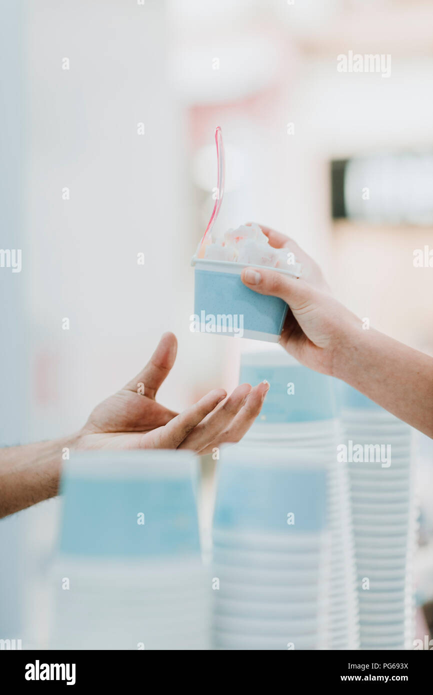 Handing drink to man hi-res stock photography and images - Alamy