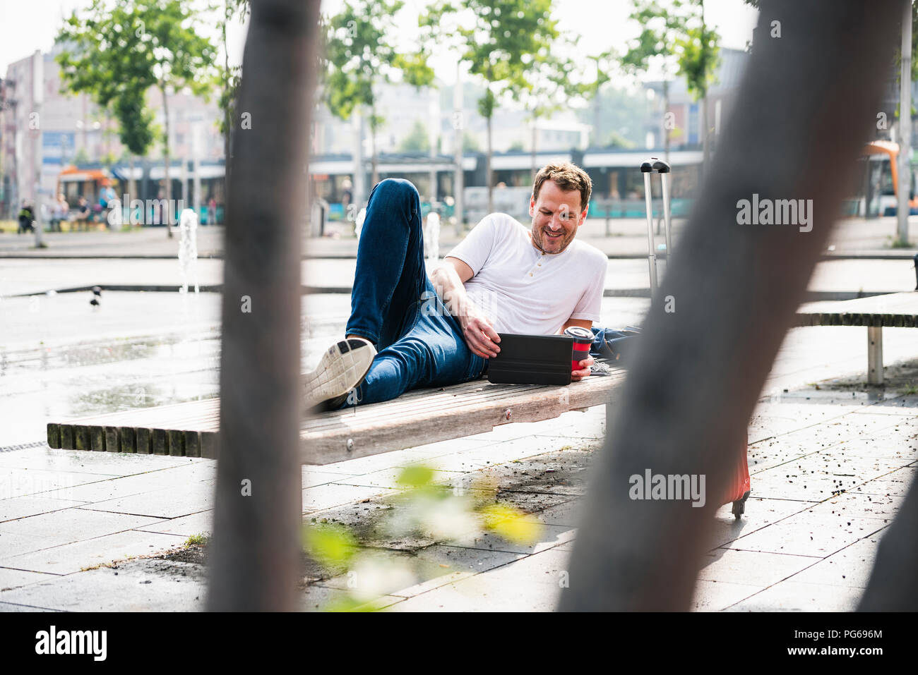Man lying down bench hi-res stock photography and images - Alamy