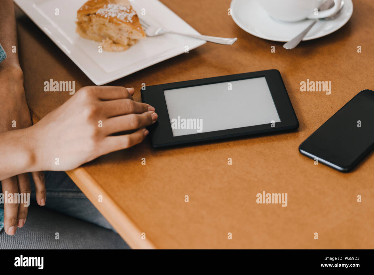 Hand woman table cake digital tablet hi-res stock photography and ...