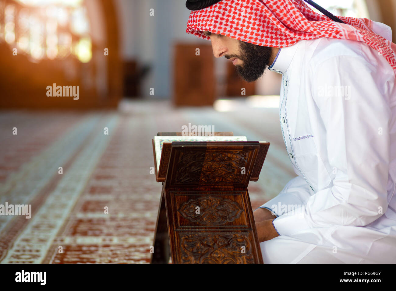 Two religious muslim man praying together inside the mosque Stock Photo ...