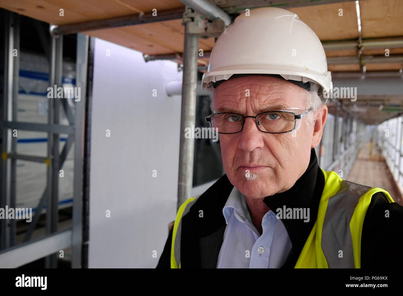 Construction manager with new building hi-res stock photography and ...