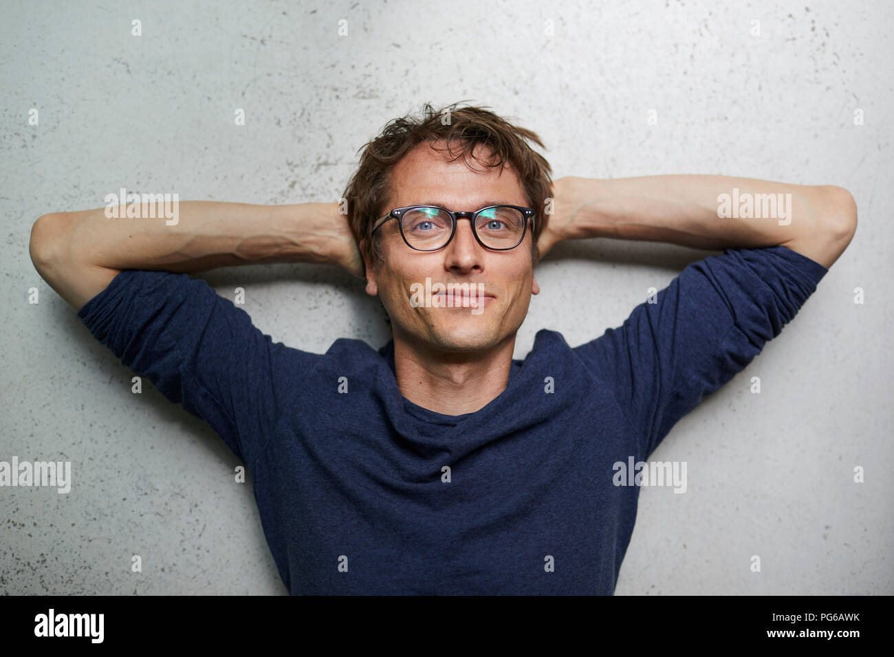 Hands behind head from back man hi-res stock photography and images - Alamy