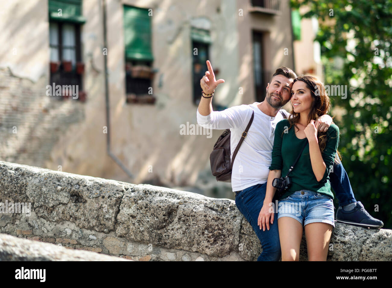 Tourist couple exploring the city Stock Photo - Alamy