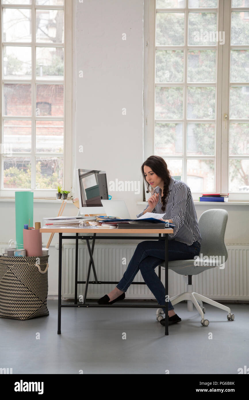 Woman working desk loft office hi-res stock photography and images - Alamy