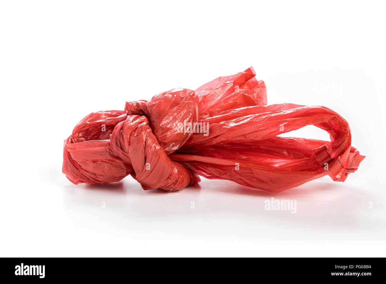 Red Plastic Bag close up with white background Stock Photo - Alamy