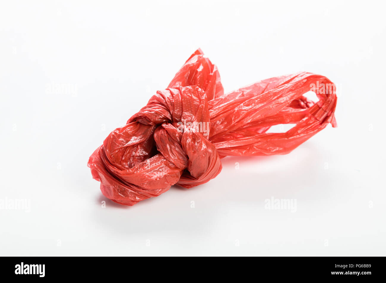 Red Plastic Bag close up with white background Stock Photo - Alamy