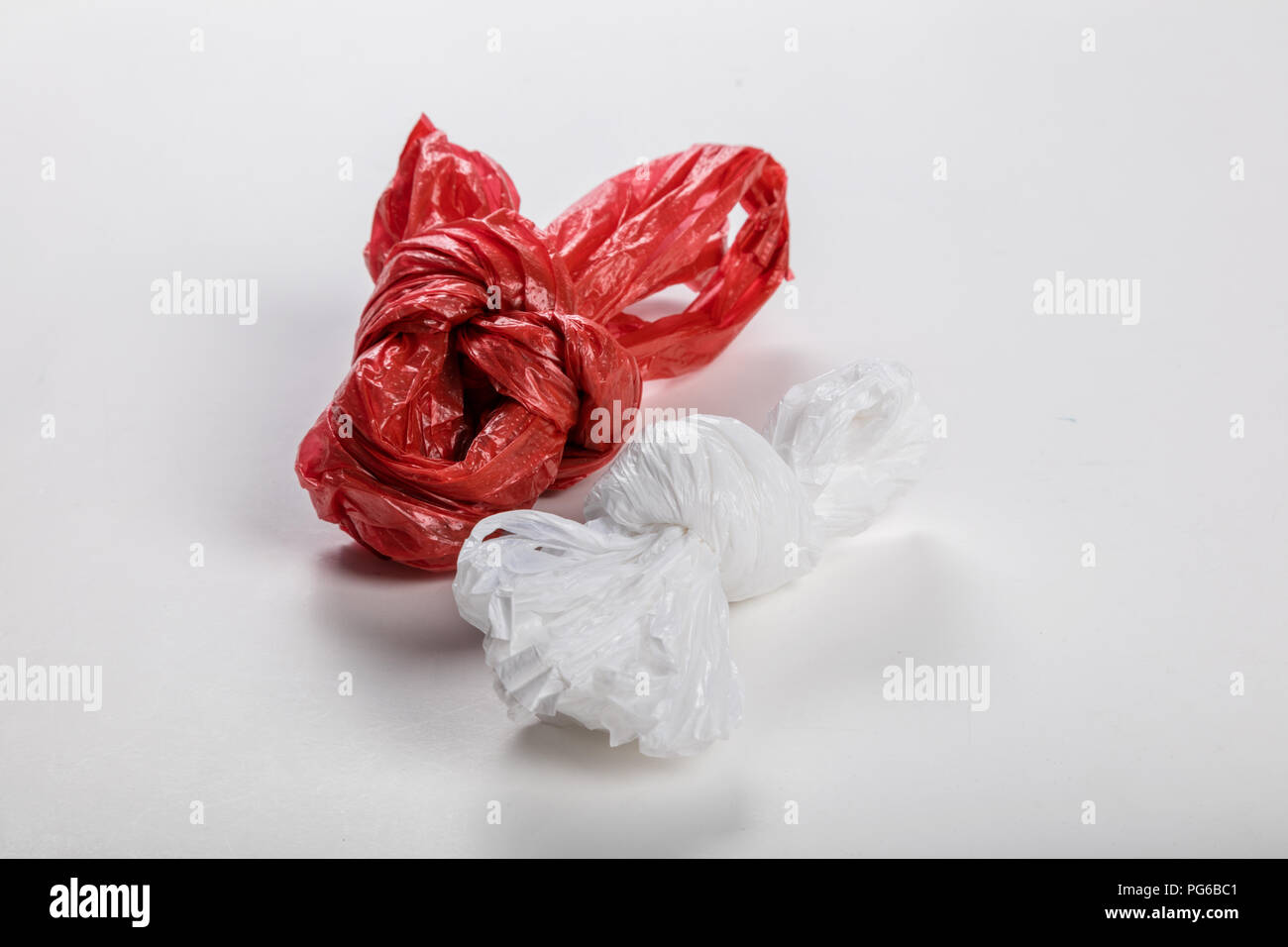 Red Plastic Bag close up with white background Stock Photo - Alamy