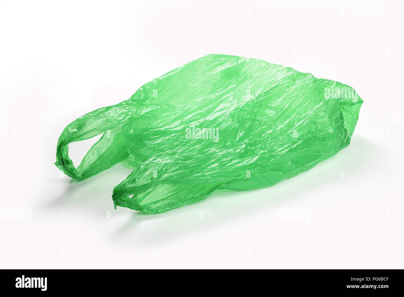 Green Plastic Bag close up with white background Stock Photo - Alamy